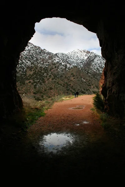 View of the mountains through one of the tunnels on Tunnel Drive, an ...