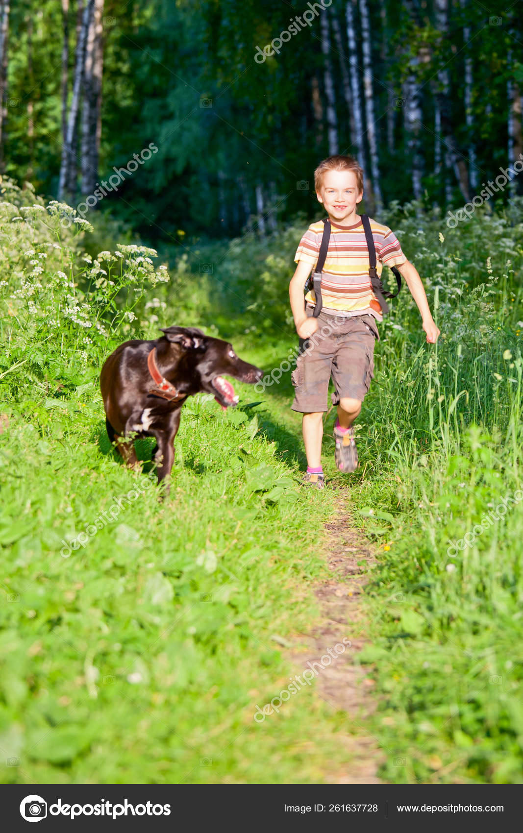 Happy Cute Boy Running Black Dog – Stock Editorial Photo © YAYImages ...