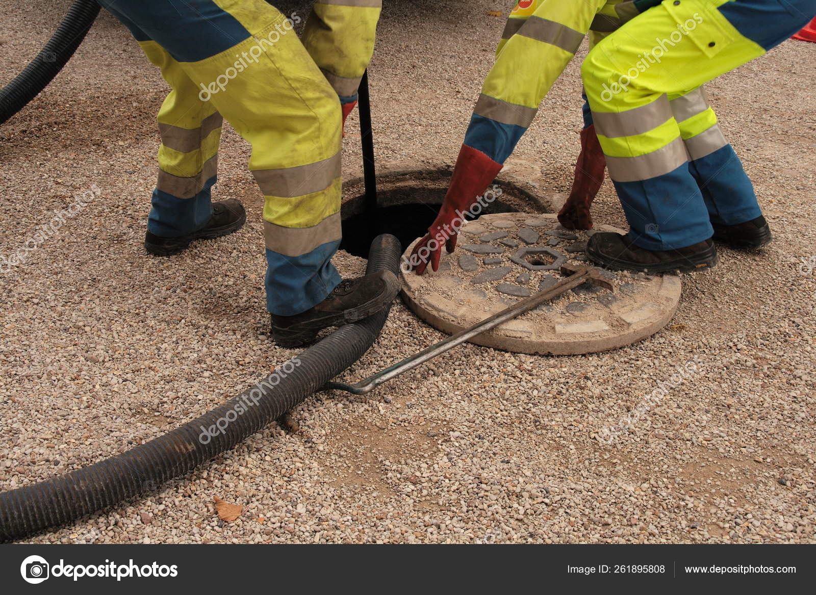 Sewer Workers Action Cleaning Sewers Stock Photo by ©YAYImages 261895808