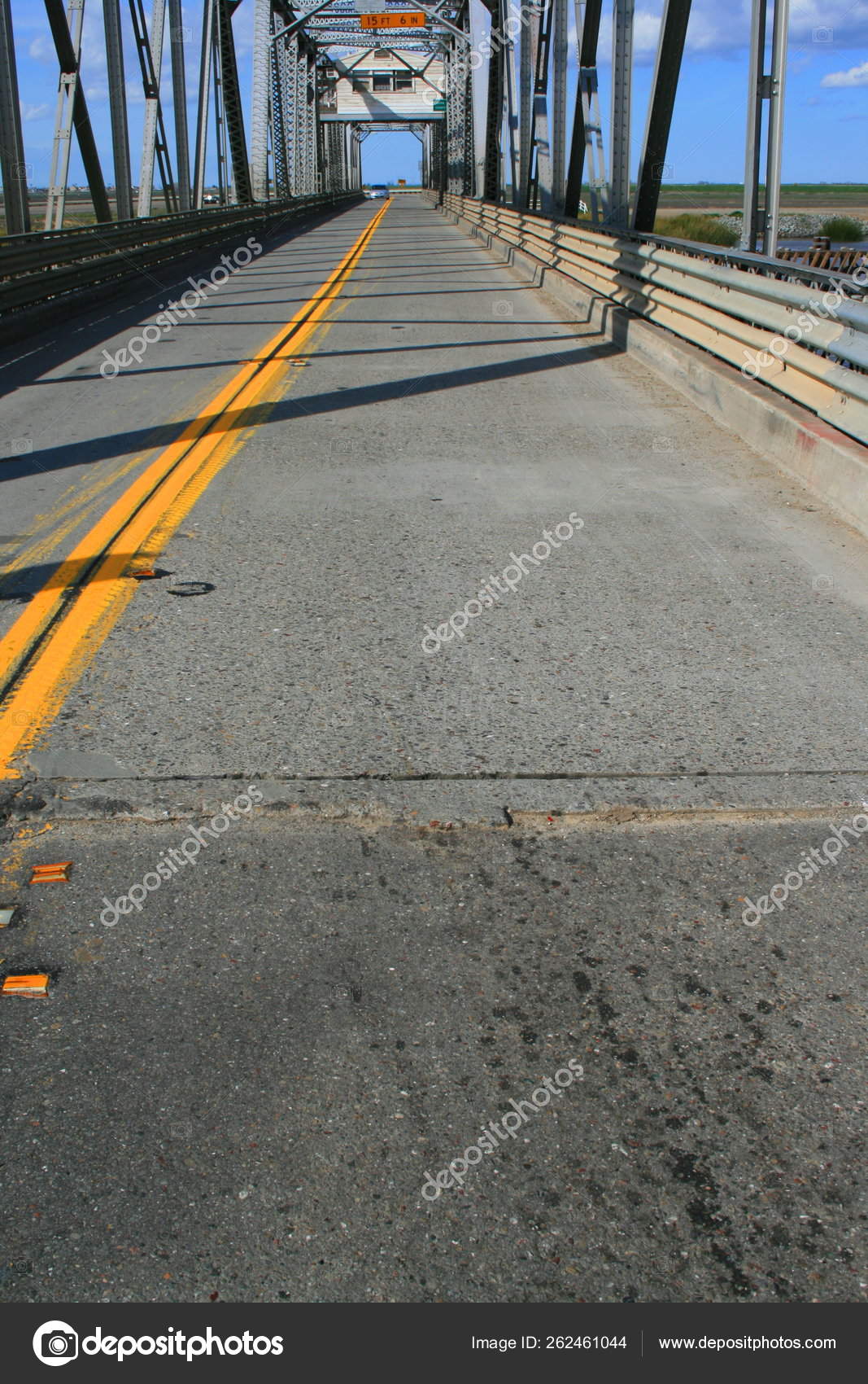 Two Lane Road Bridge Separated Yellow Lines Stock Photo by ©YAYImages ...