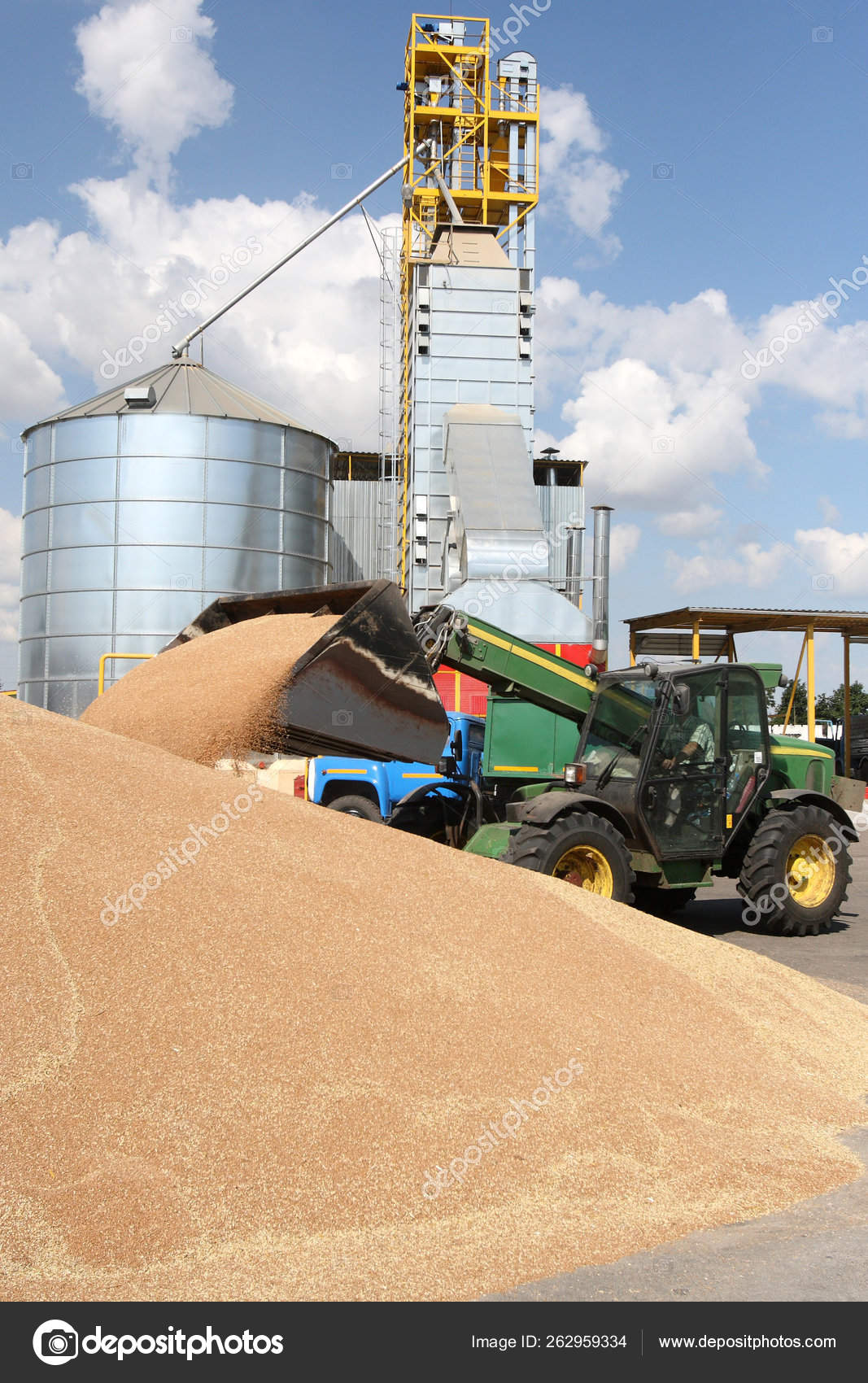 Grain Loading Farm Tractor Warehouse Stock Photo by ©YAYImages 262959334