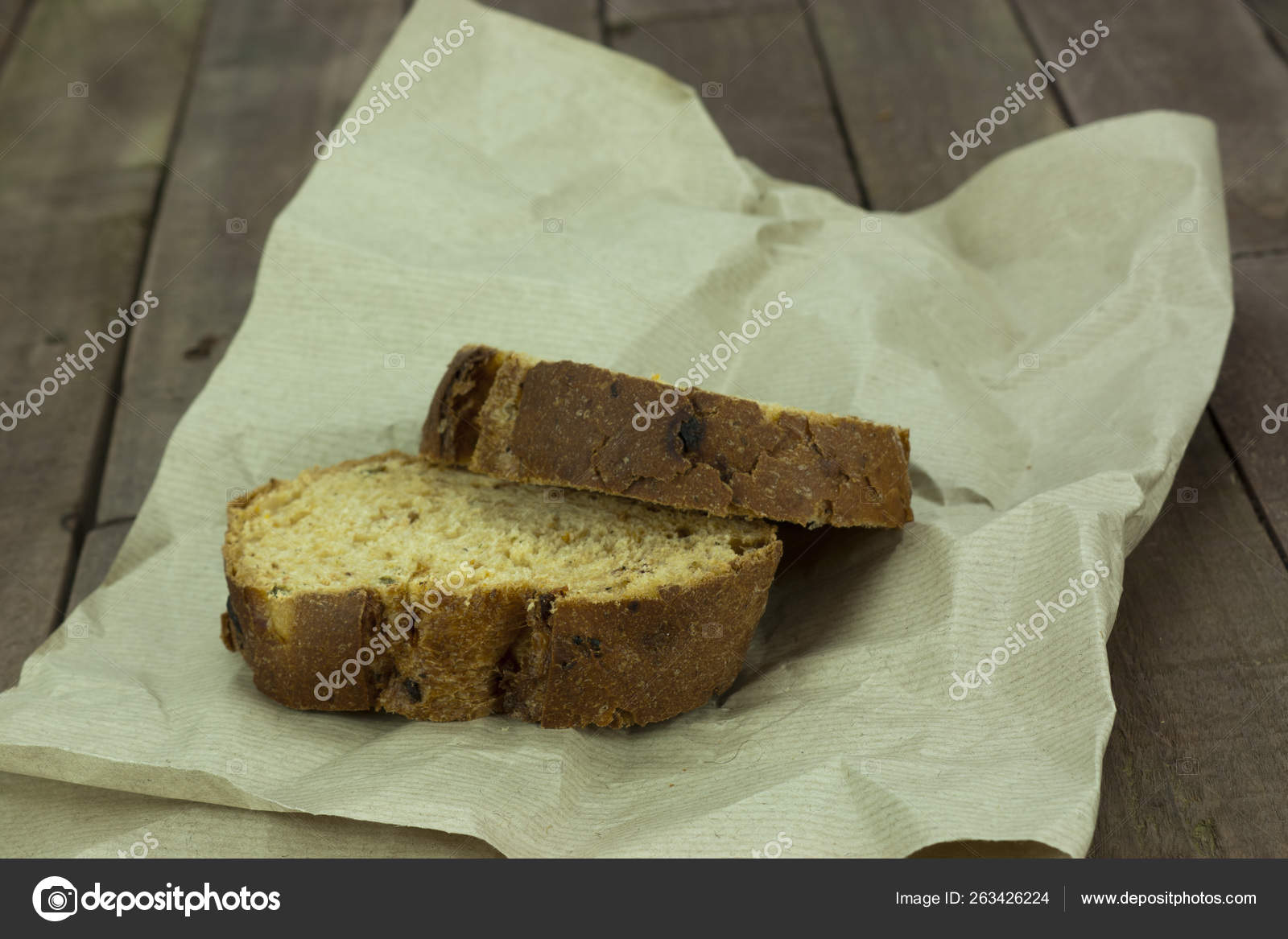 Cut Fresh Wholemeal Bread Sheet Brown Paper Stock Photo by ©YAYImages ...