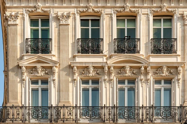 Facade of one of the beautiful buildings along Champs Elysees avenue ...