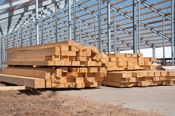 Wooden beams on steel structure for further construction. Metal frame ...