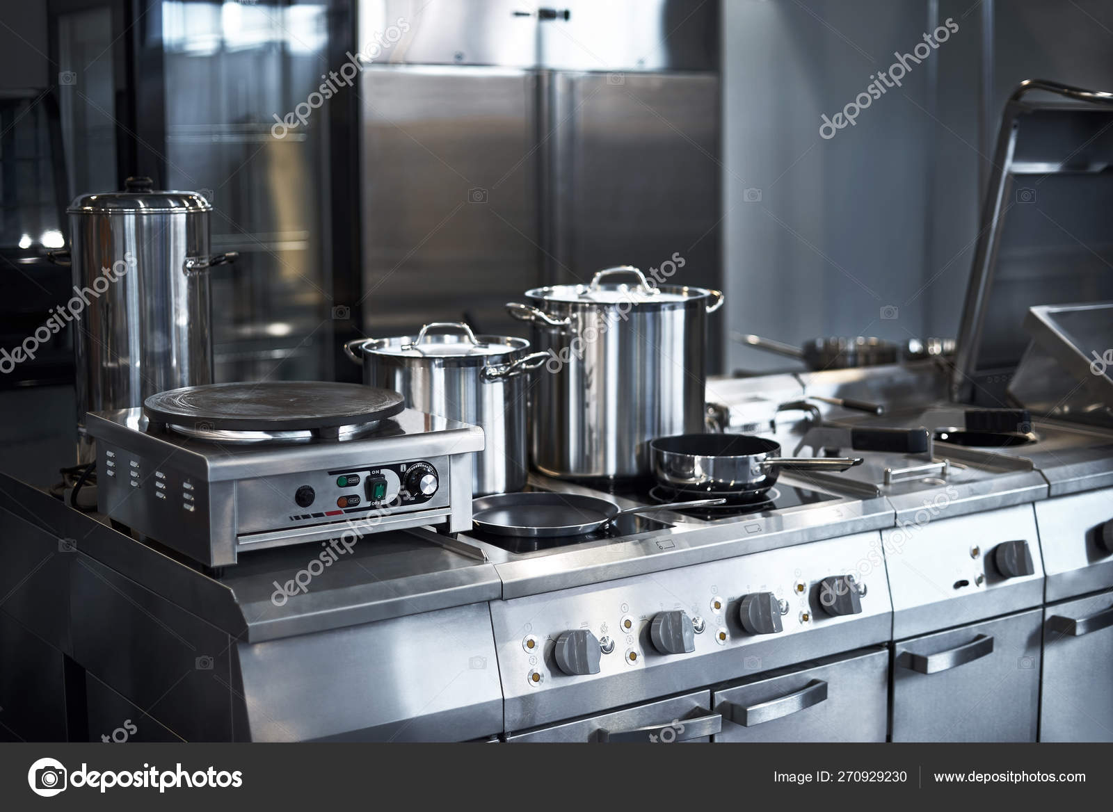 Work surface and kitchen equipment in professional kitchen, view ...