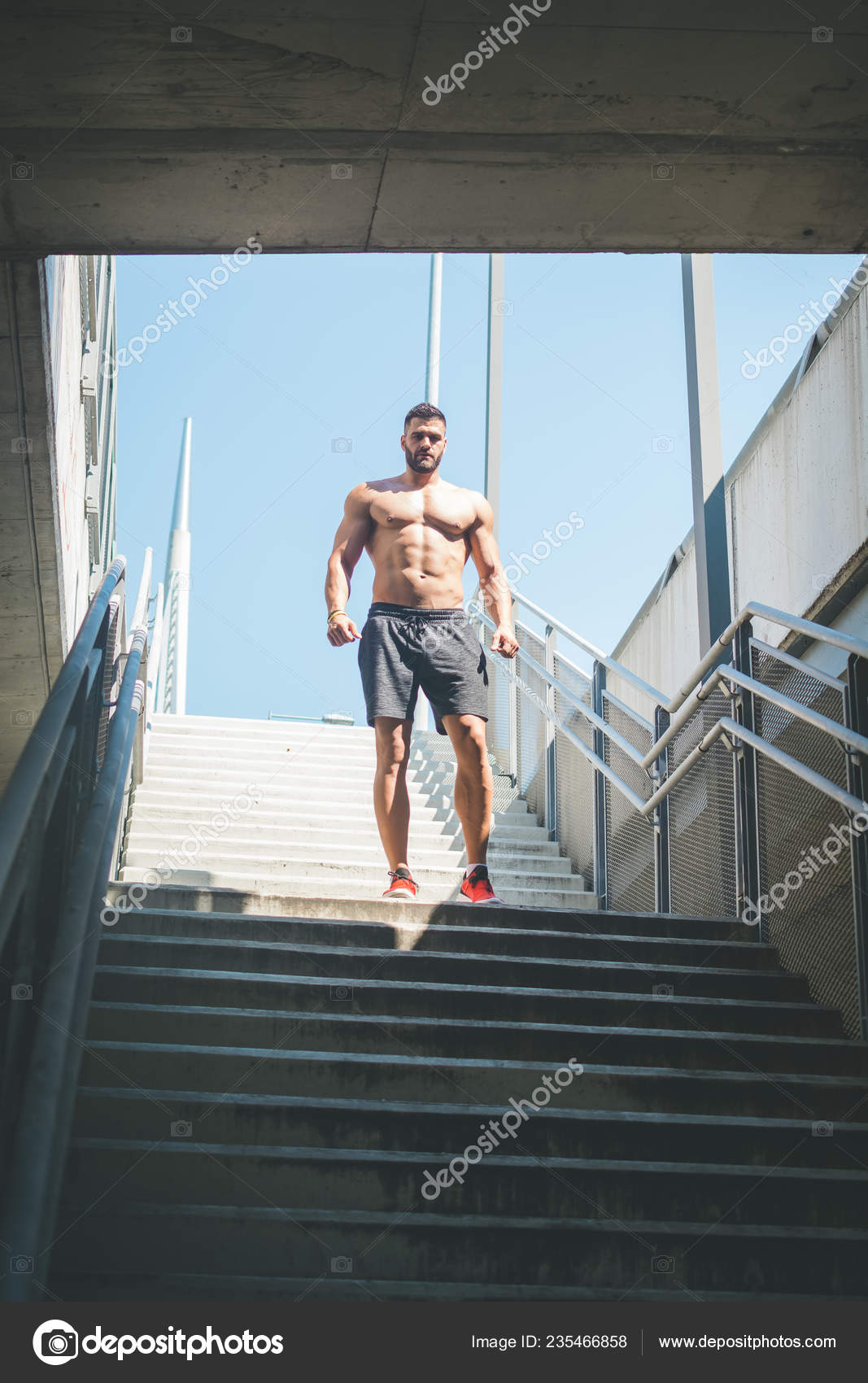 Young Athletic Build Man Standing Stairs — Stock Photo © IgorSinkov ...