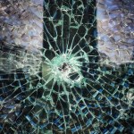 Stomping throught a glass window. Stock Photo by ©mj0007 148255465