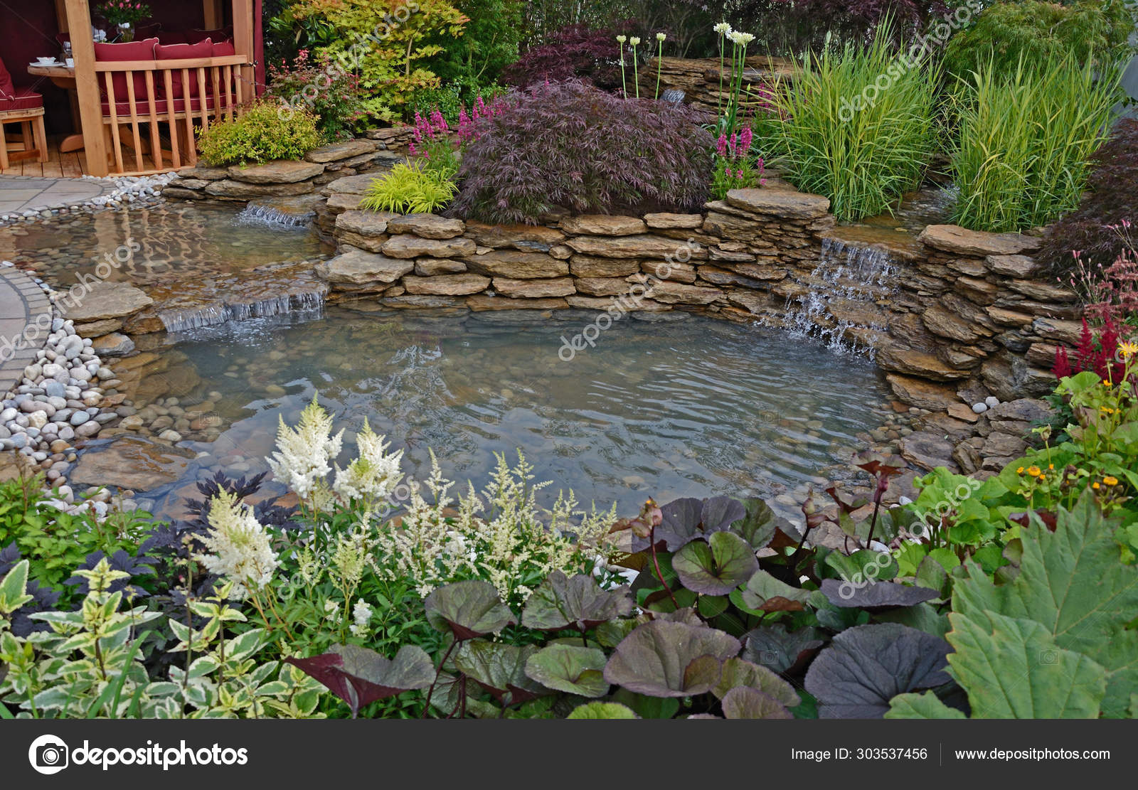 The pond area and terrace with Summer House in an aquatic garden ...