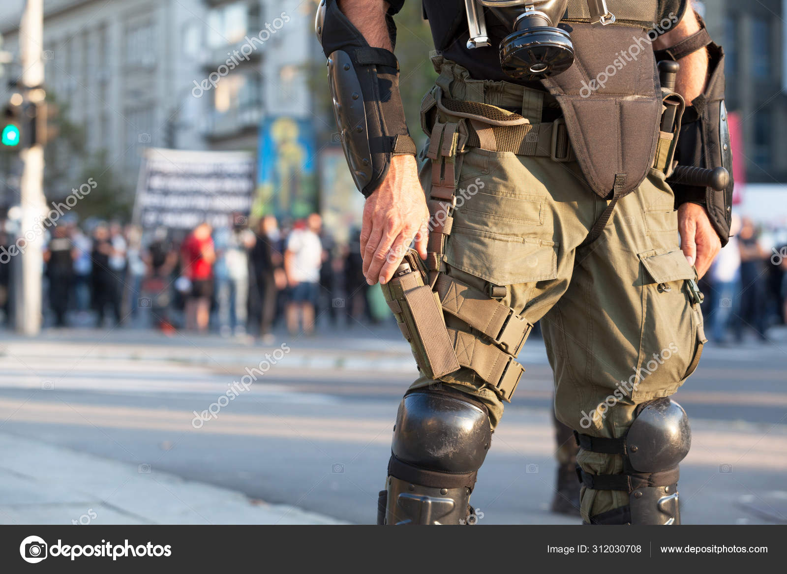 Armed riot police officer on duty during street protest Stock Photo by ...