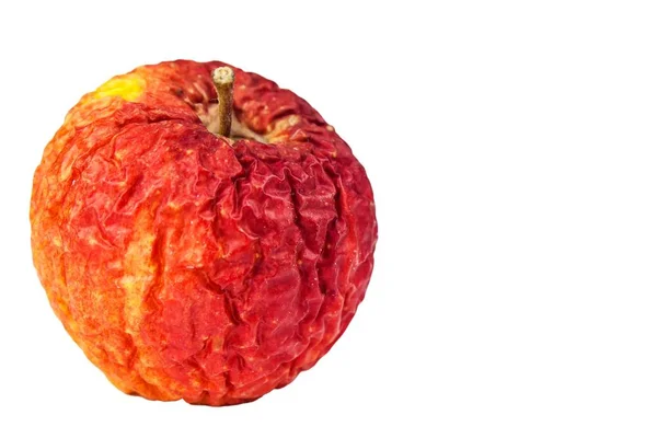 Wrinkled apple texture with white background. Shriveled apple. Old ...