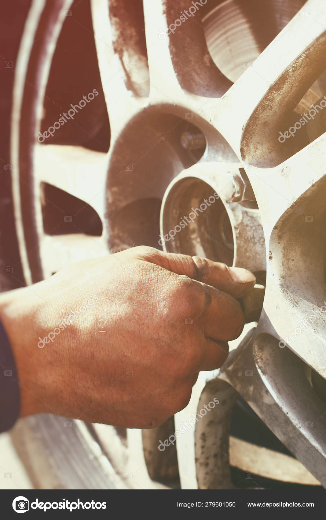 A man hand during wheel nut tightening process close up view — Stock ...