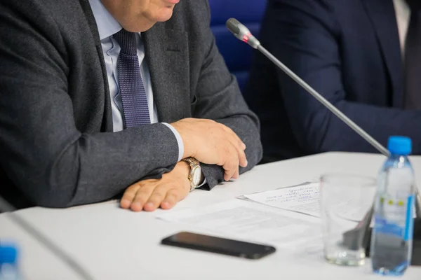 Press conference. Public speaker giving talk to Television camera. News ...