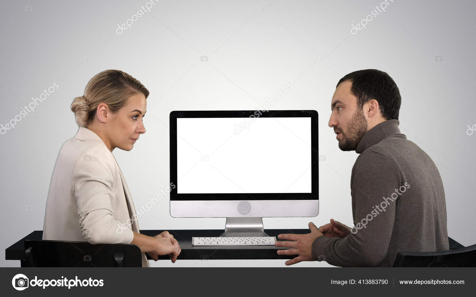 Business people having meeting around monitor of computer talkin ...