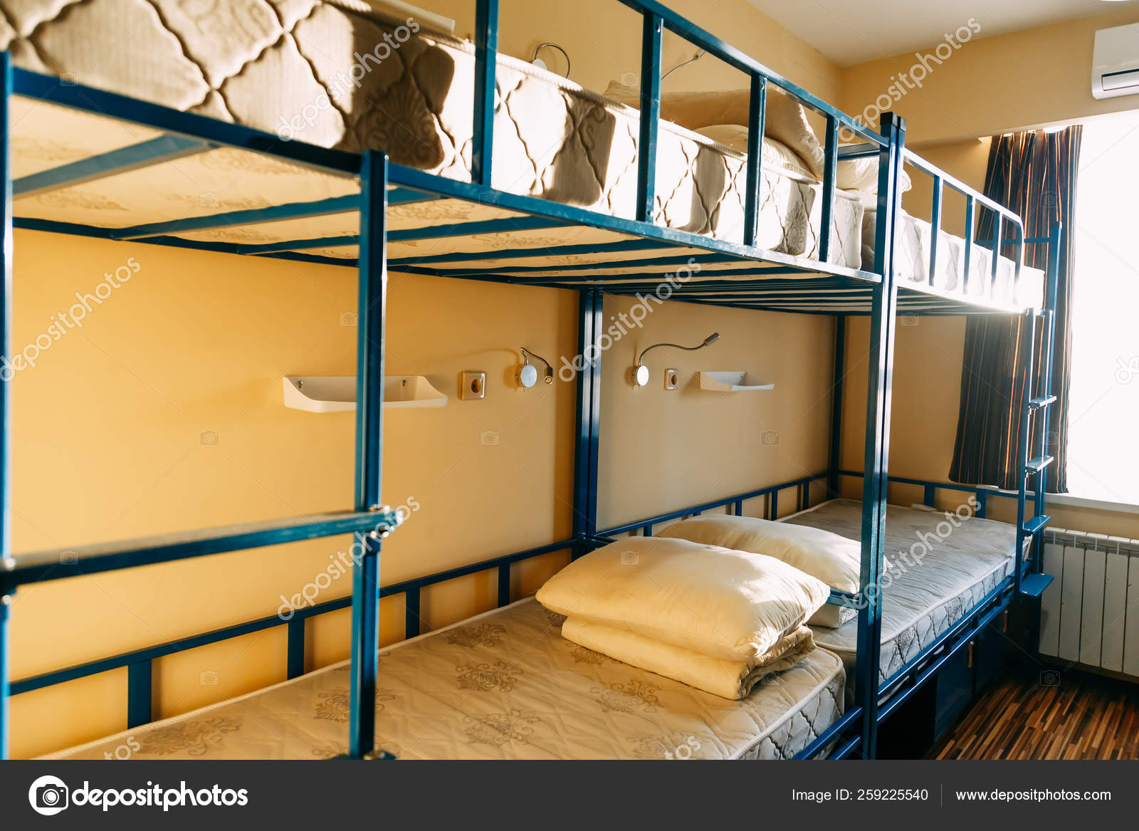 Morning inside the hostel bedroom with clean white beds for students ...