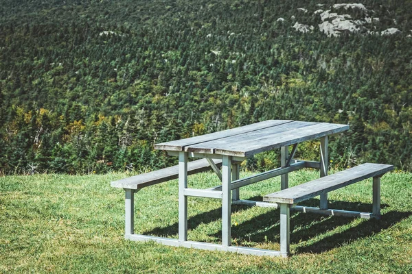 Picnic table on a mountain slope - Stock Image - Everypixel