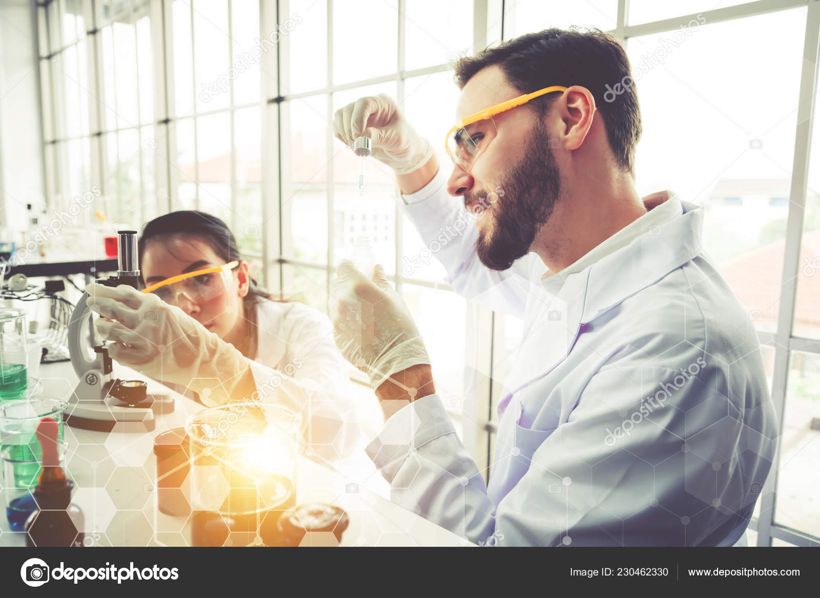 Two Scientists Experimenting Lab Room Stock Photo by ©theevening 230462330