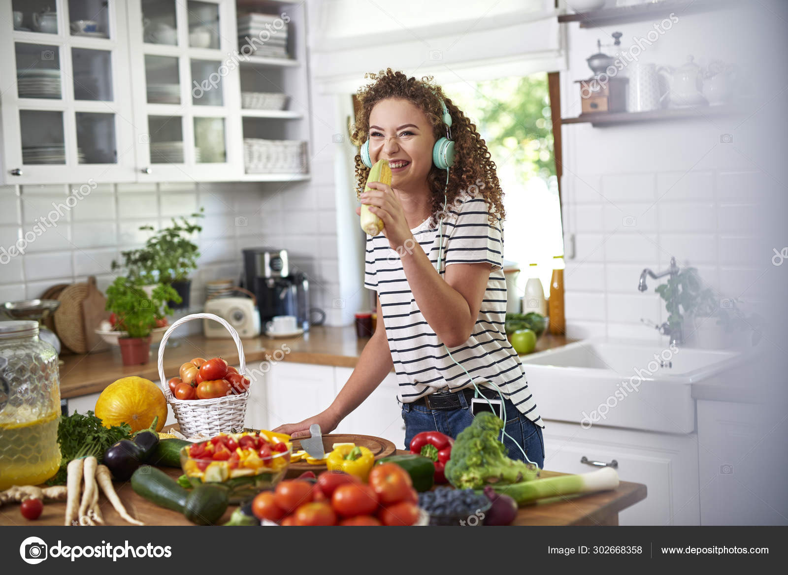 Woman Singing While Cooking Meal Stock Photo by ©gpointstudio 302668358