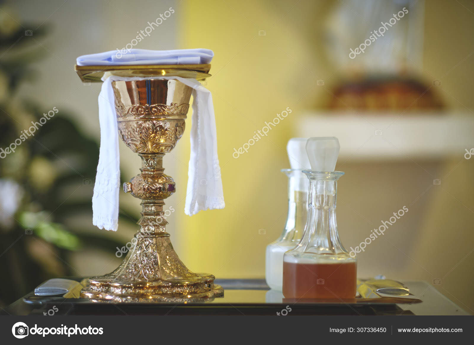 Golden chalice on the altar during mass and other sacred objects Stock ...