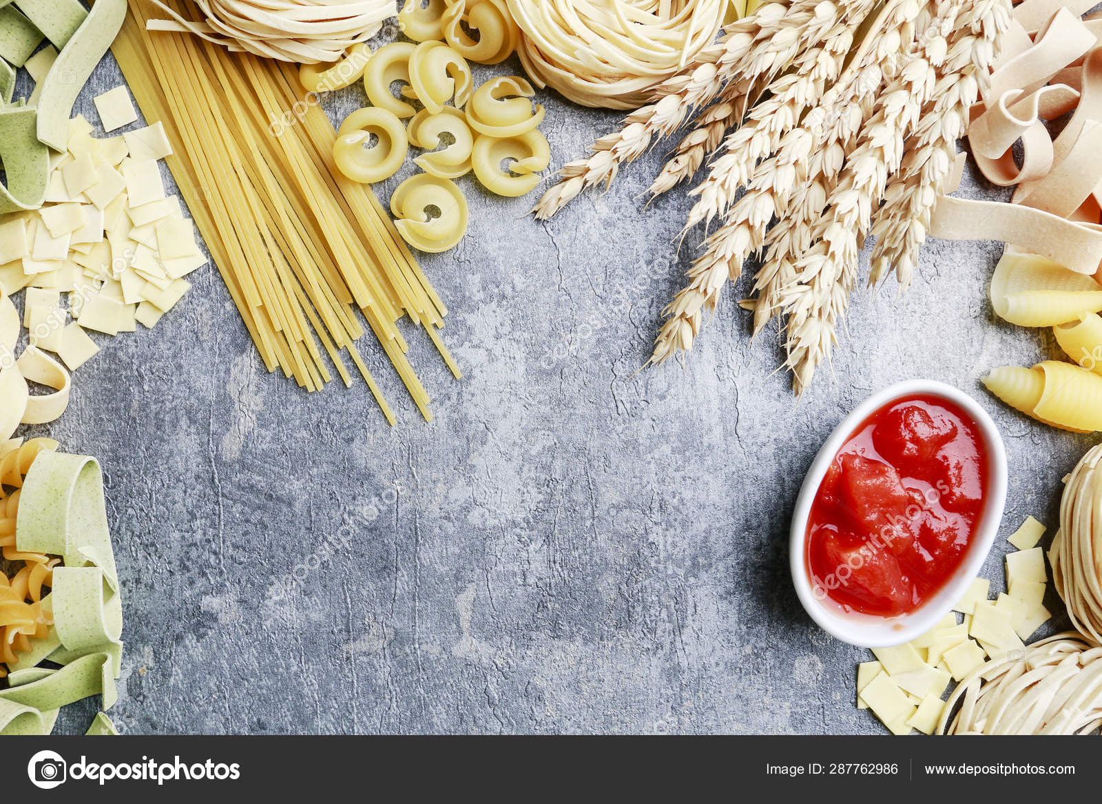Mixed types and shapes of italian pasta on grey stone, backgroun Stock ...
