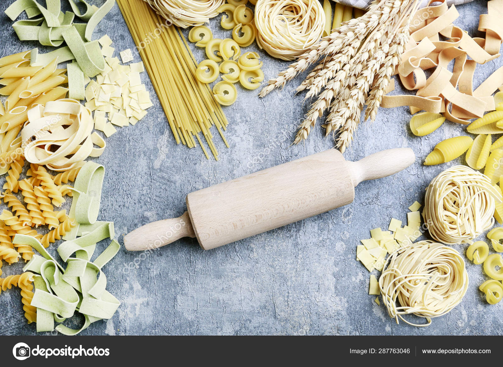 Mixed types and shapes of italian pasta on grey stone, backgroun Stock ...