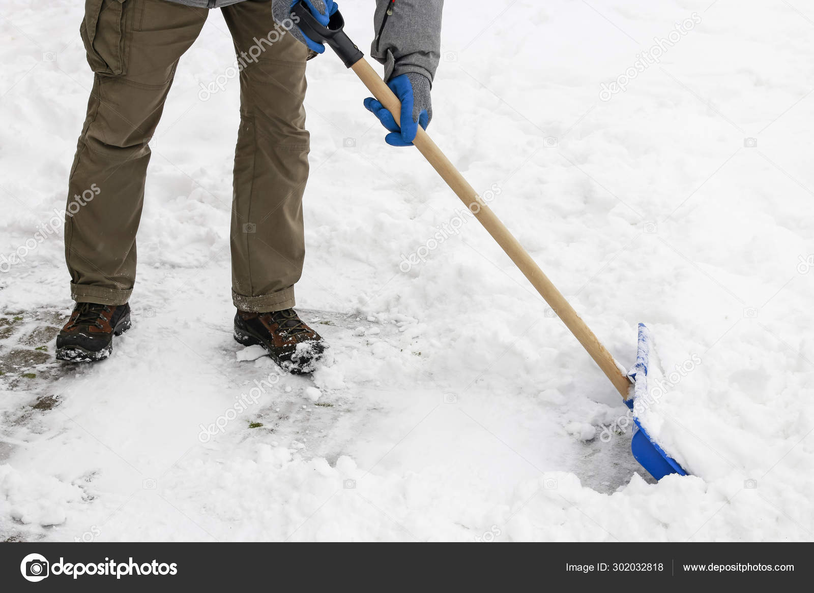 Man removing snow from the sidewalk after snowstorm. Stock Photo by ... Man removing snow from the sidewalk after snowstorm. Stock Photo by ...