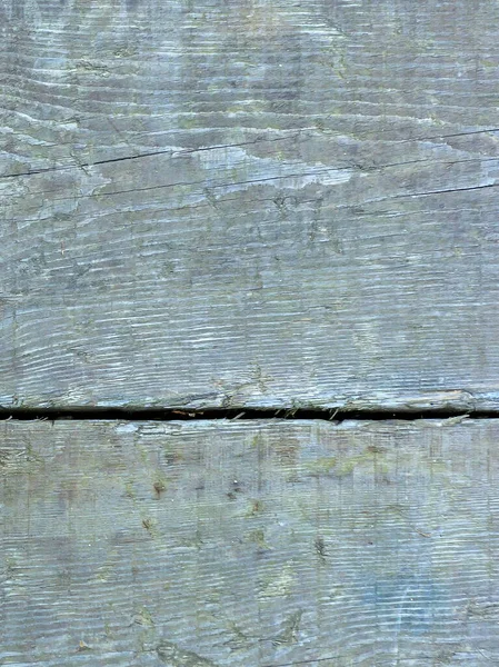 Old wood, in the form of roughly planed boards used in the construction ...