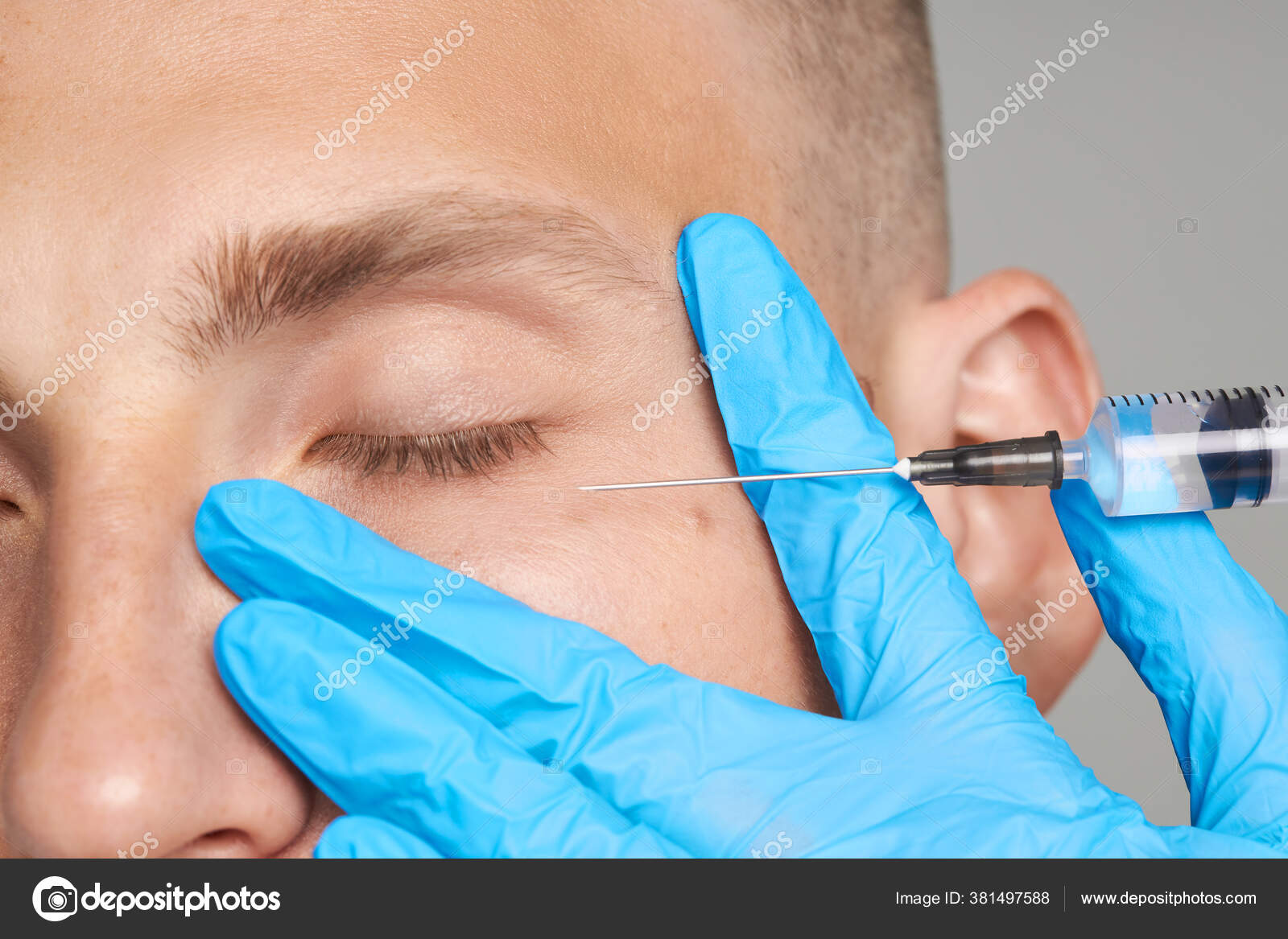 Injection Male face treatment. Close-up of a man with closed eyes ...
