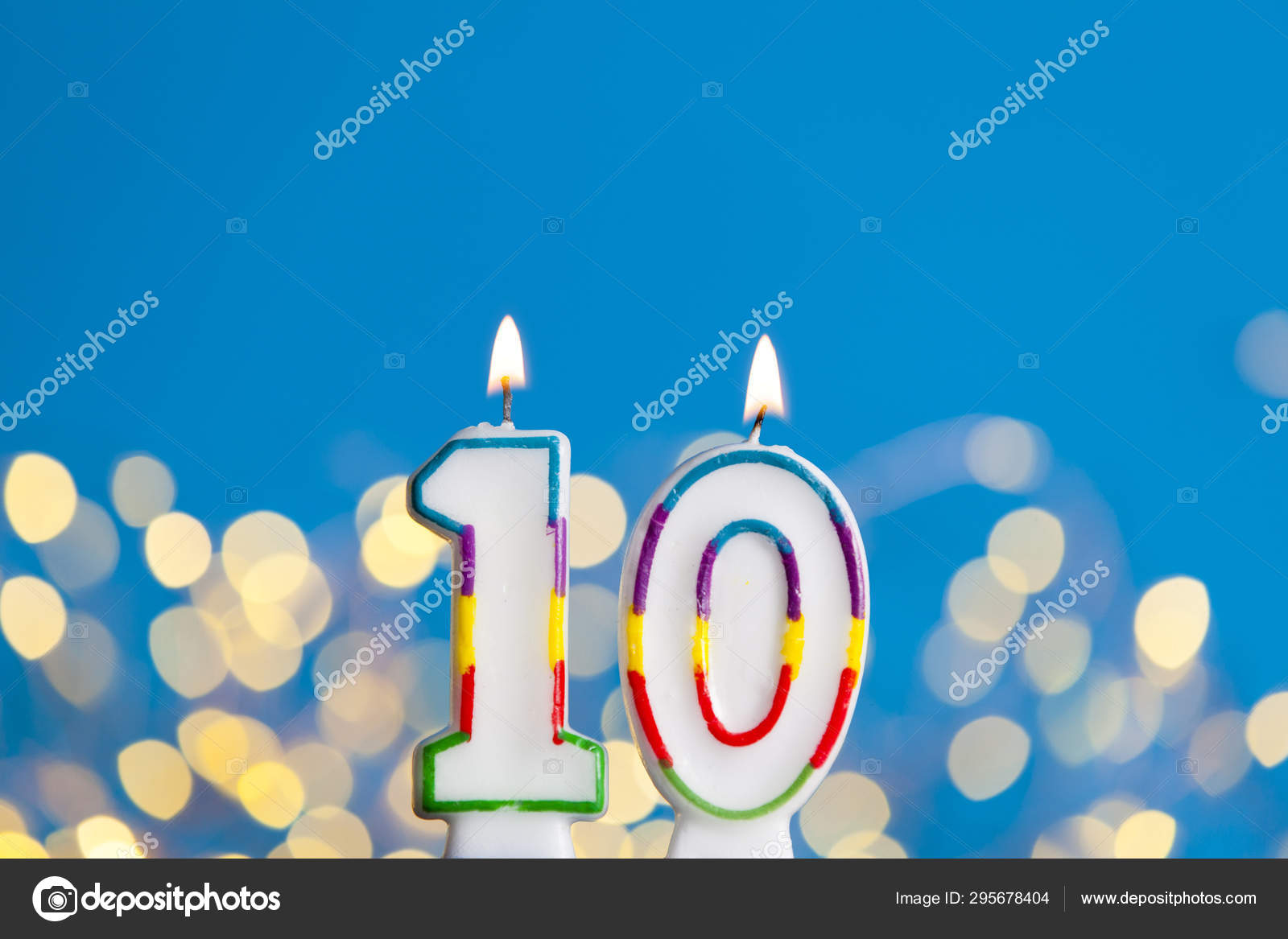 Number 10 birthday celebration candle against a bright lights an Stock ...