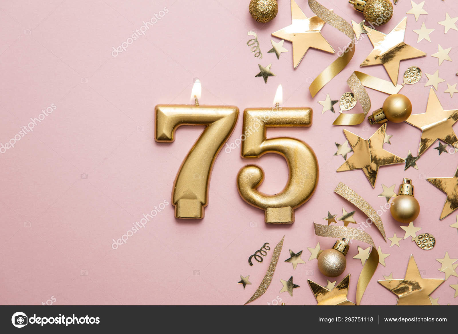 Number 75 gold celebration candle on star and glitter background Stock ...