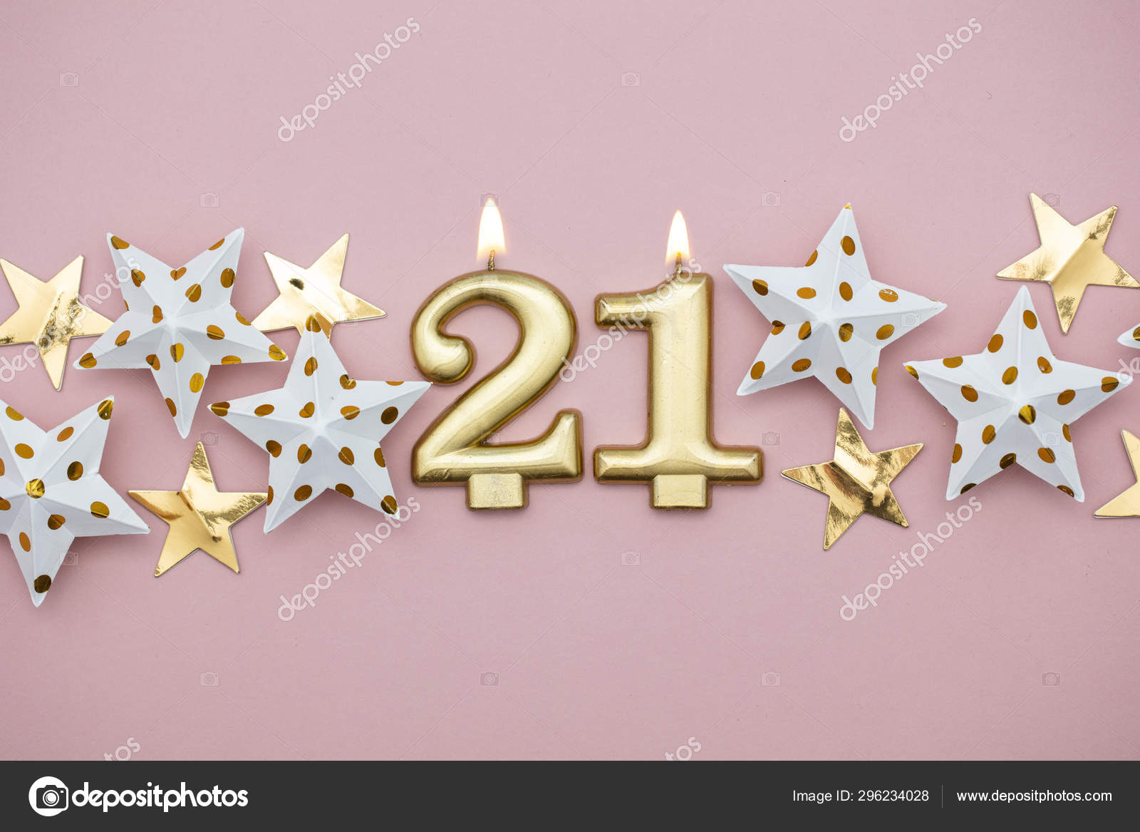 Number 21 gold candle and stars on a pastel pink background Stock Photo ...