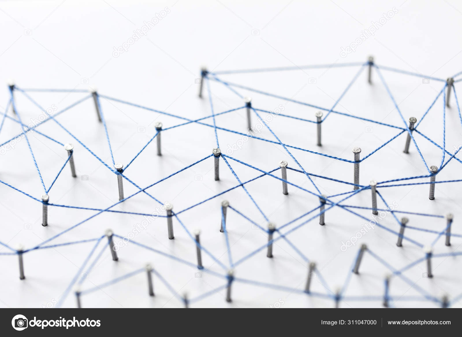 A large grid of pins connected with string. Communication, techn ...