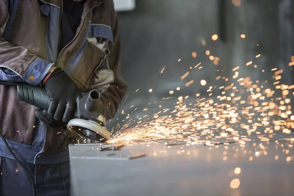 Grinding of materials in metallurgy workshop Stock Photo by ©MexChriss ...