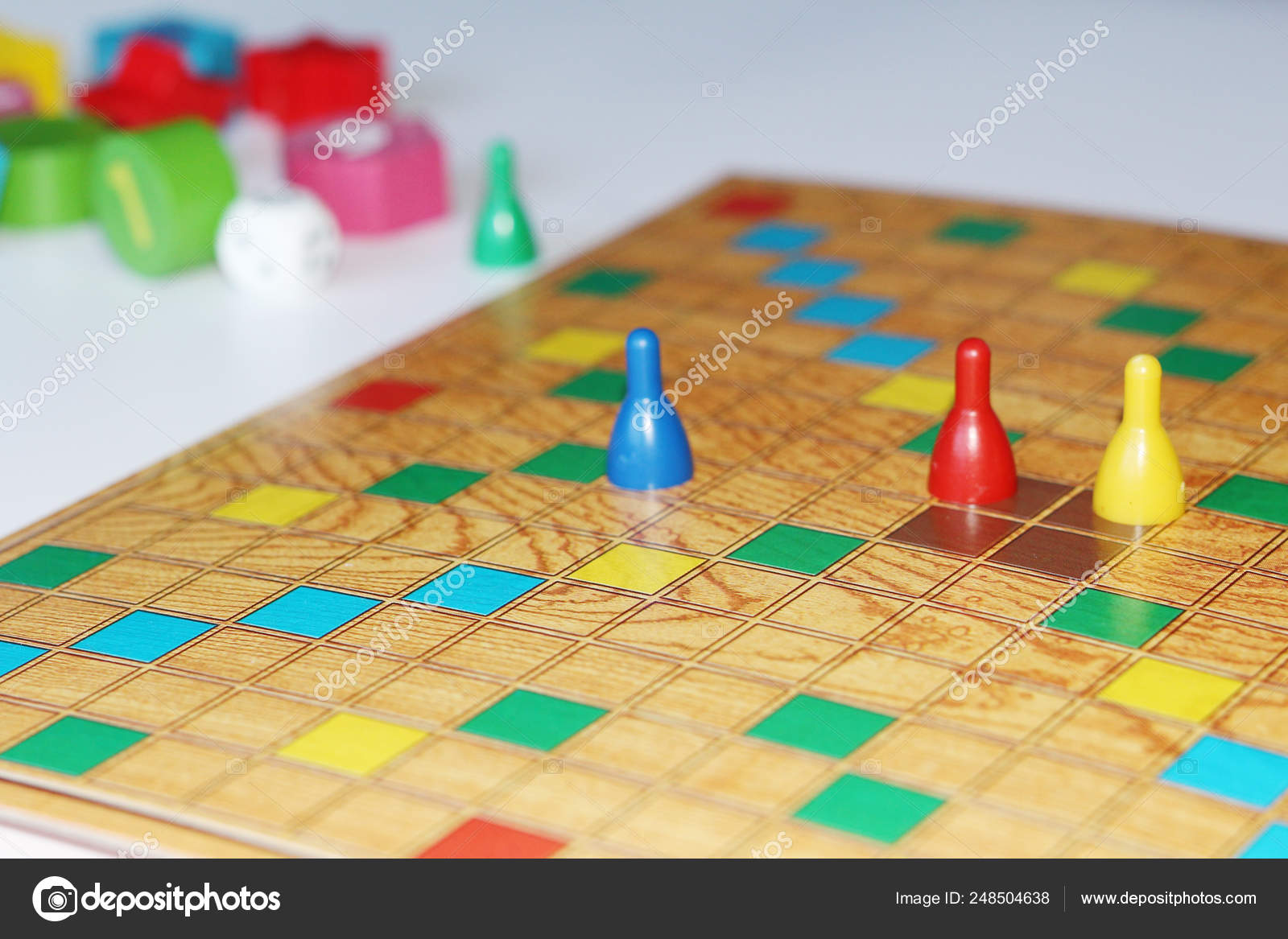 Cube, chips, wooden figures, a bright field for the game. — Stock Photo ...