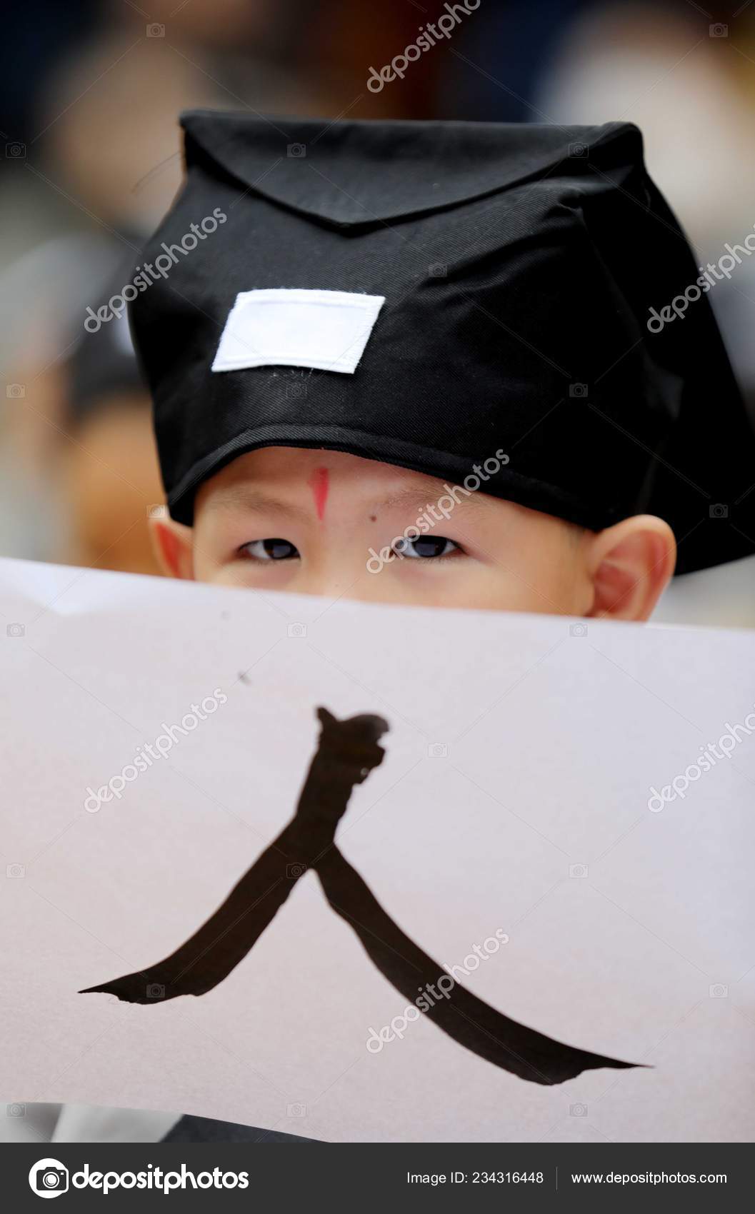 Child Shows His Chinese Calligraphy Ren Meaning Human English First ...
