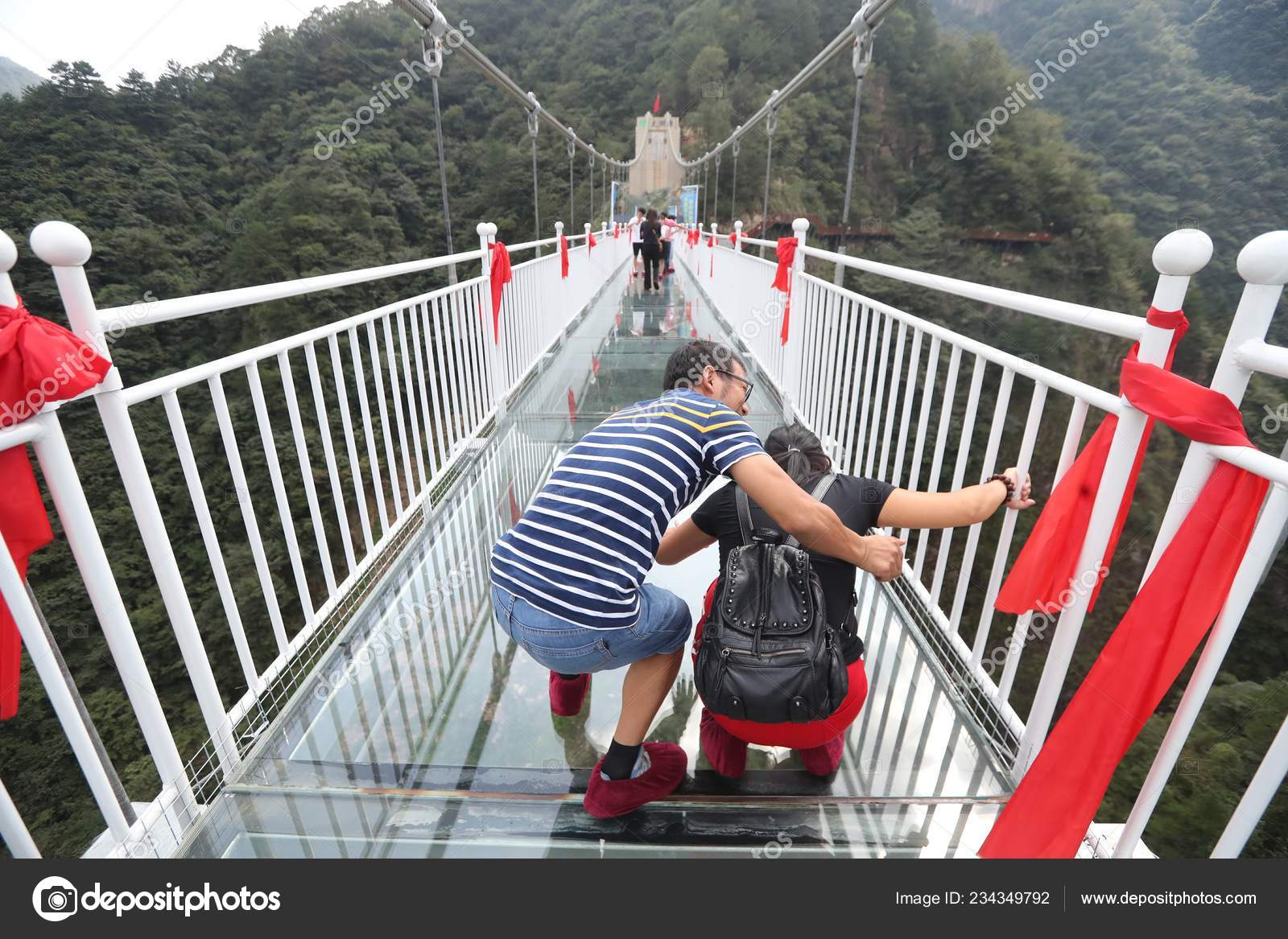 Tourist Scared She Walks Storey High Glass Bottomed Suspension Bridge ...