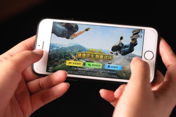 File Chinese Mobile Game Player Plays Tencent's Crossfire Island ...