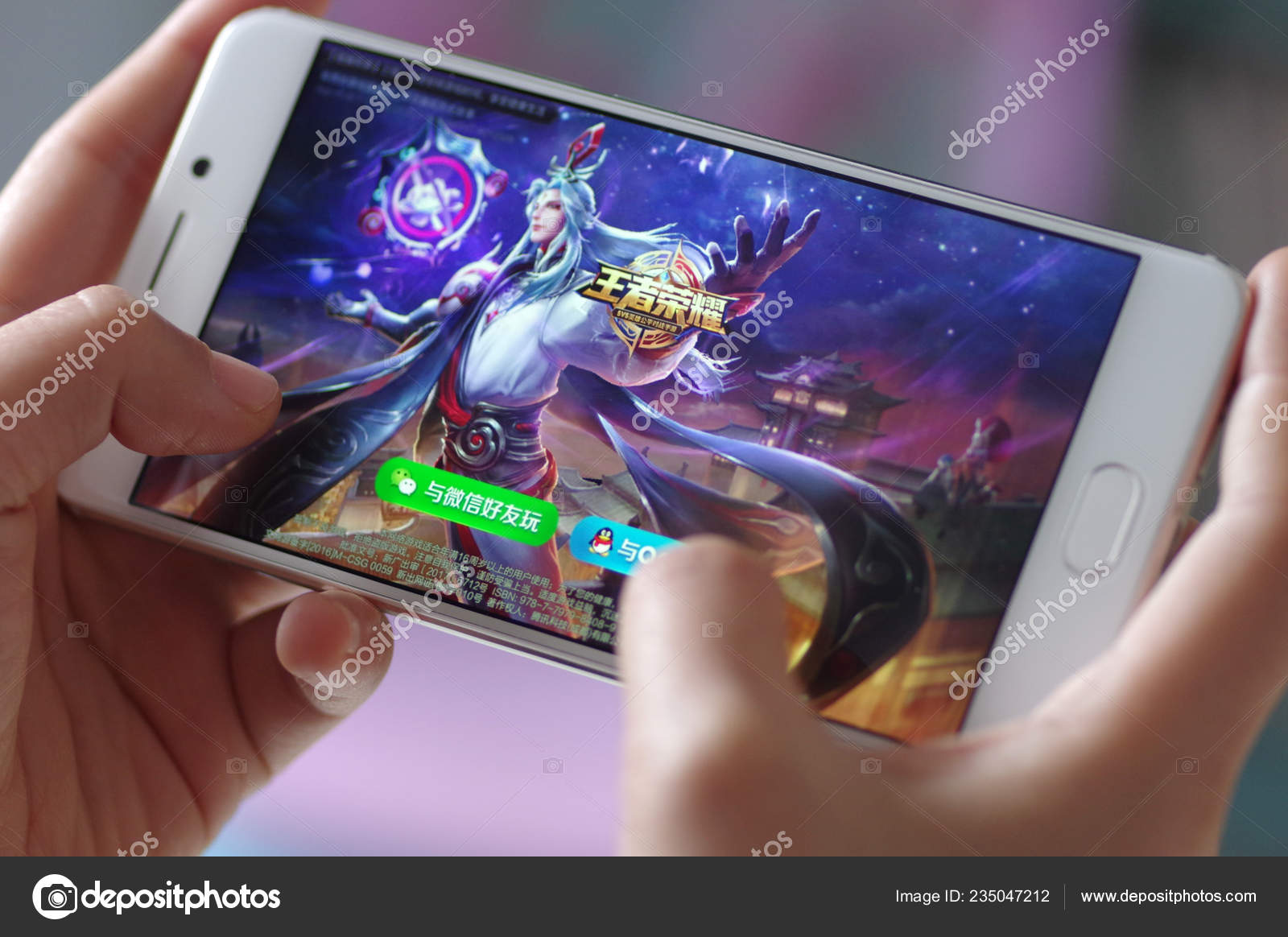 Chinese Mobile Game Player Plays Tencent's Mobile Moba King Glory ...