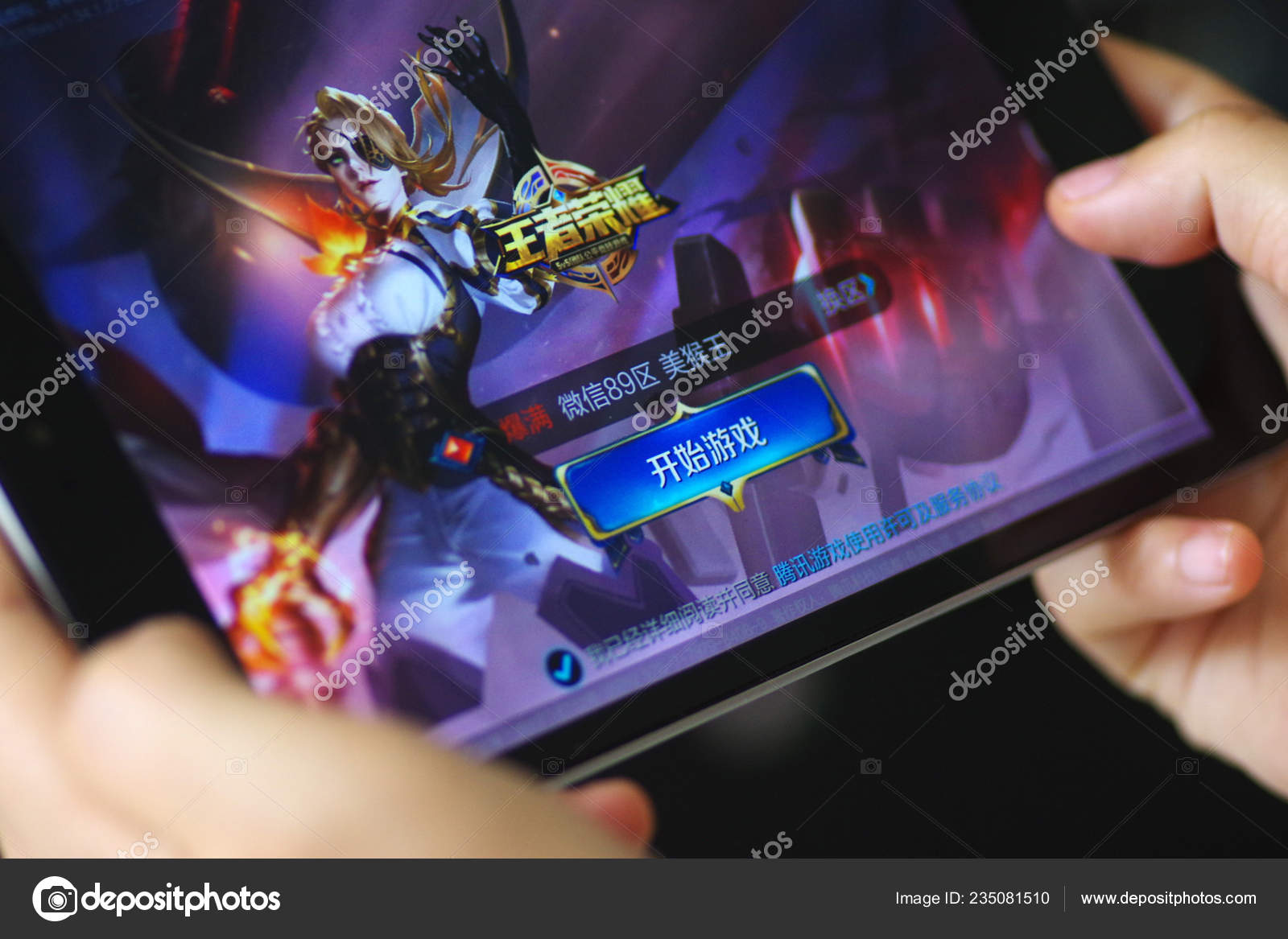 Chinese Mobile Game Player Plays Tencent's Mobile Moba King Glory ...