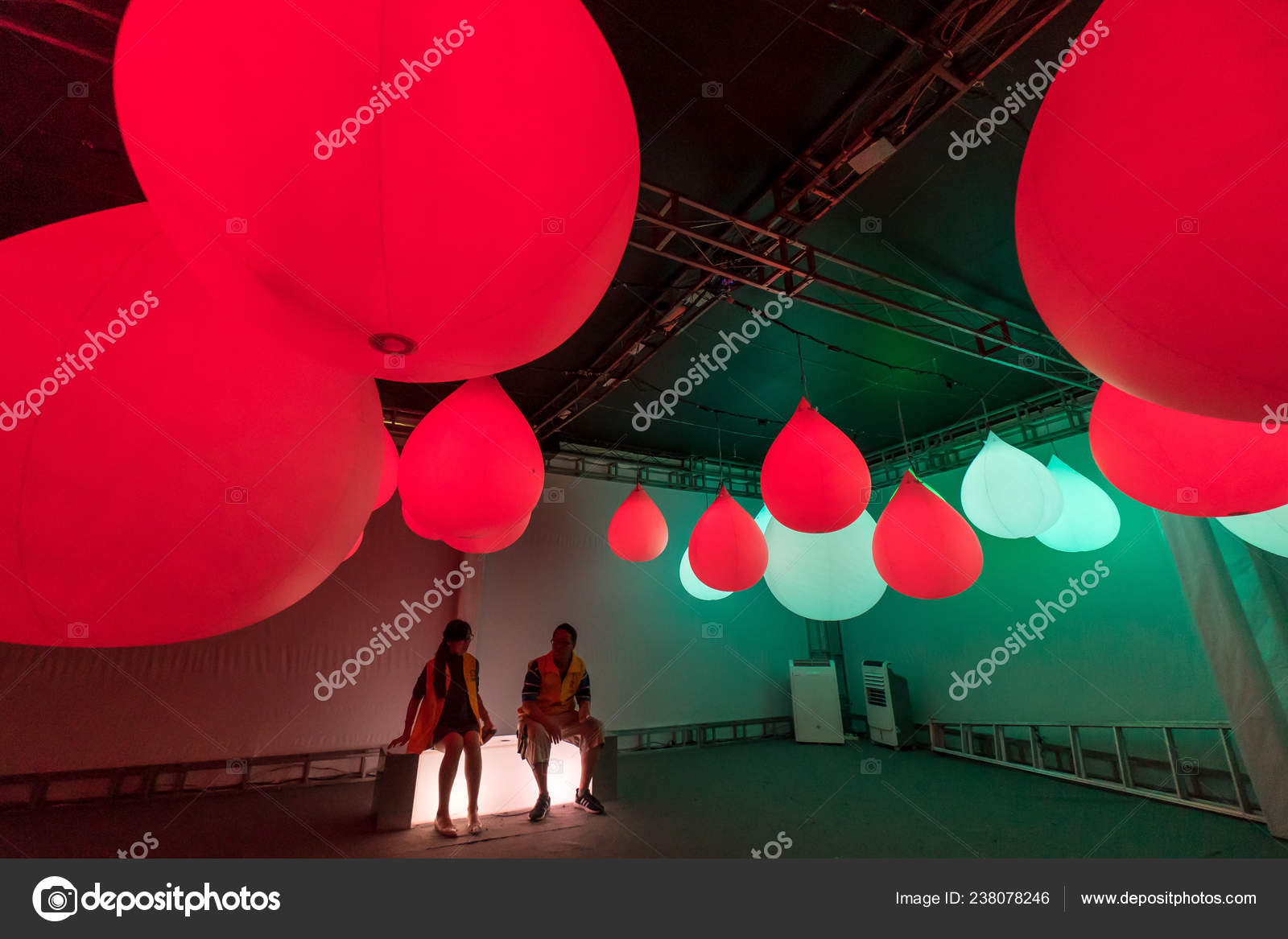 Staff Members Sit Illuminated Giant Raindrop Shaped Installations ...