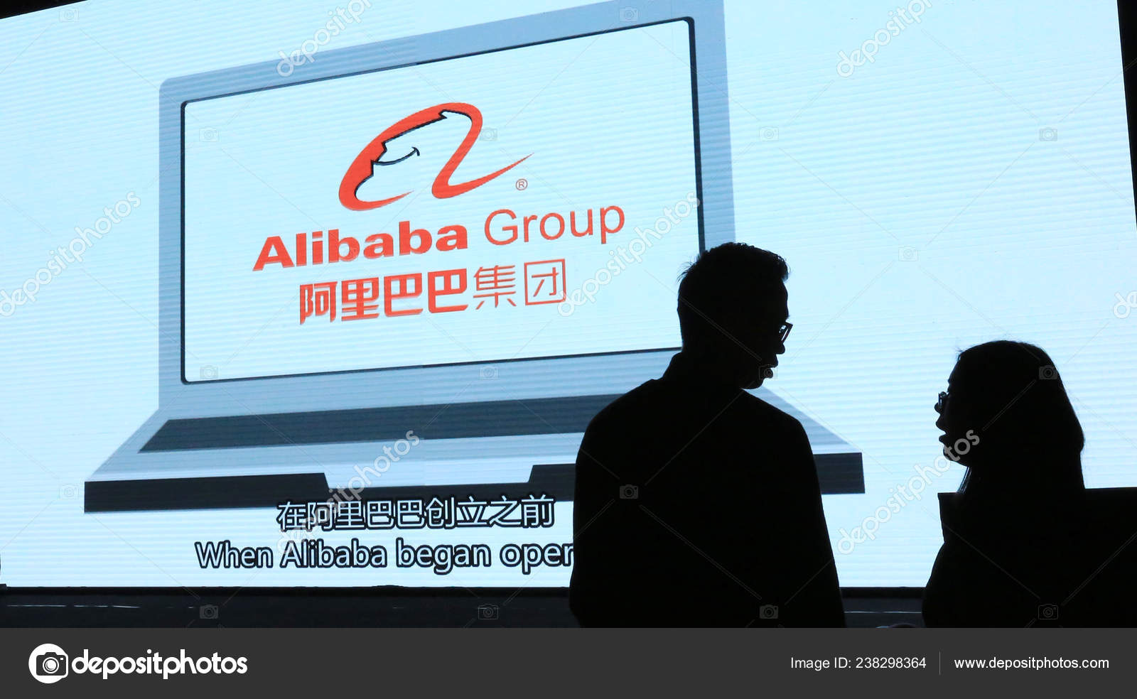 Chinese Employees Talk Front Screen Displaying Logo Alibaba Group ...