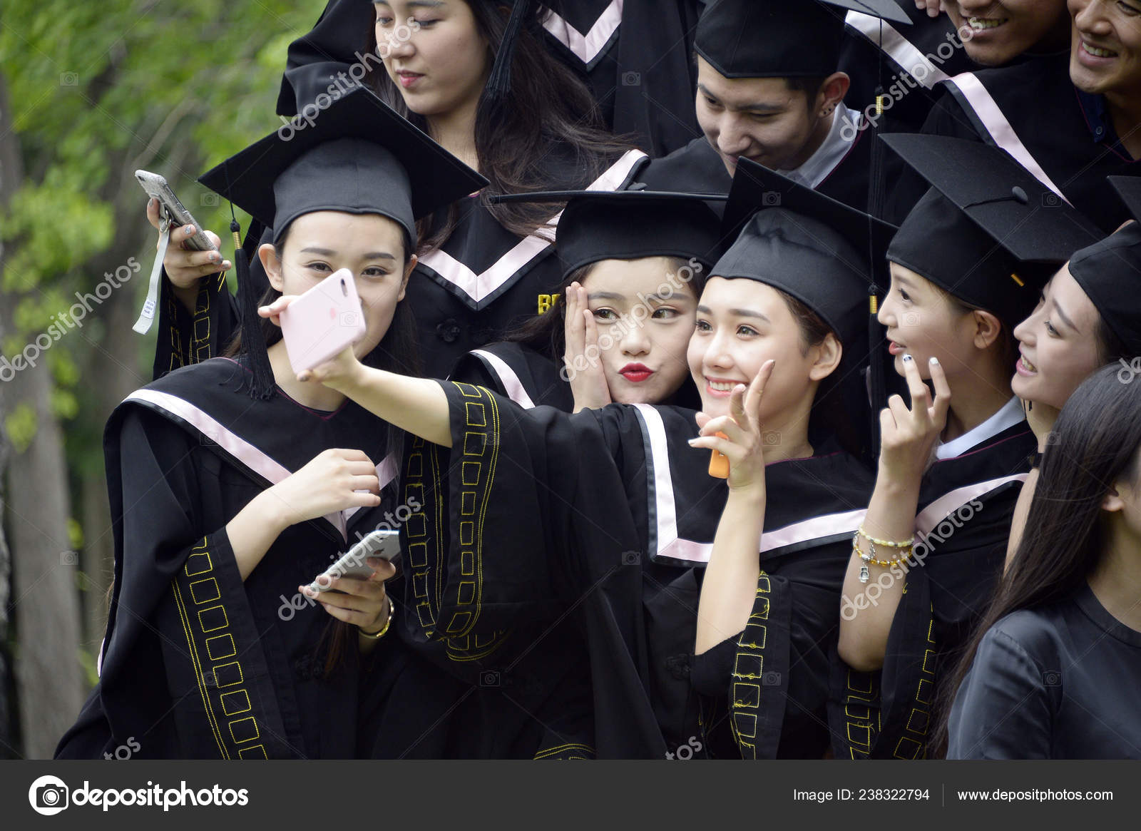 Female Chinese Graduates Dressed Academic Gowns Take Selfie Graduation ...