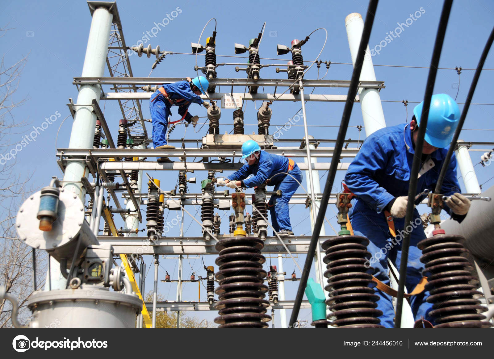 Chinese Electricians Check Repair Electrical Device Transformer Station ...