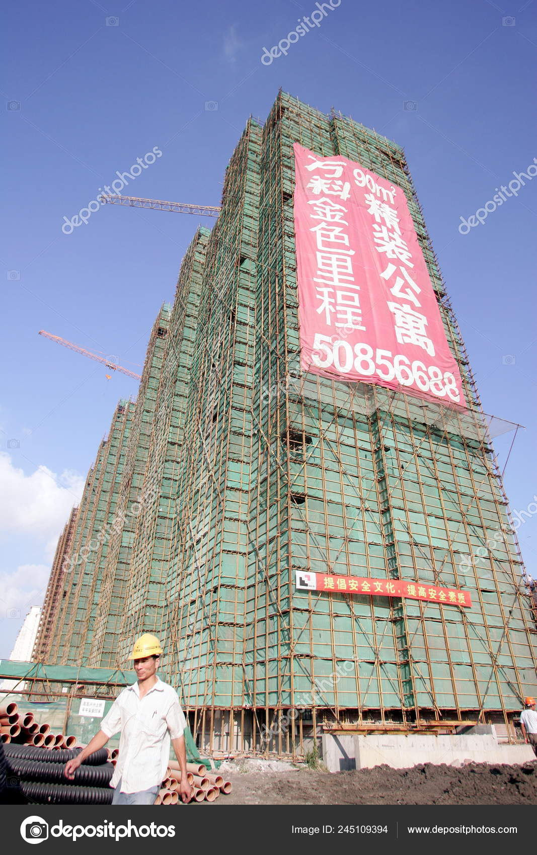 Chinese Construction Worker Walks Apartment Building Construction ...