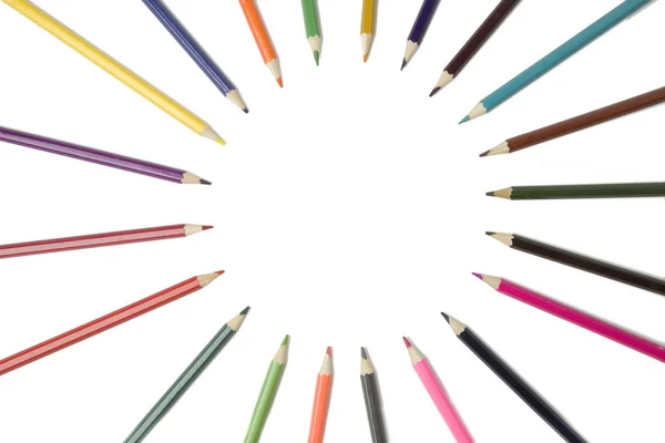 Colored pencils lie in a circle on an isolated white background. Copy ...
