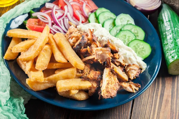 Greek gyros dish with french fries and vegetables Stock Photo by ©fotek ...