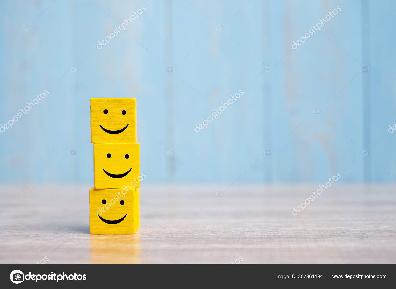 Smiley face on yellow wood cube. Service rating, ranking, custom Stock ...
