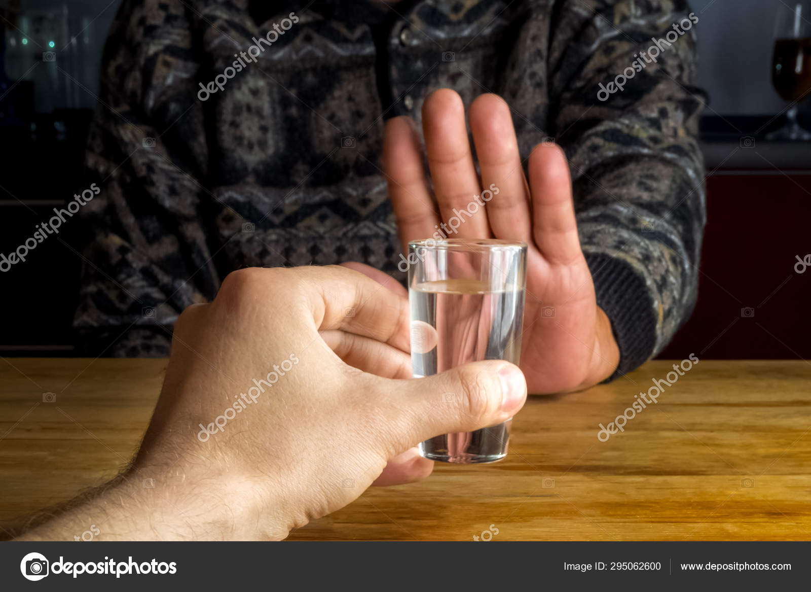 Man's hand rejecting a glass of alcoholic beverage. Concept Stock Photo ...