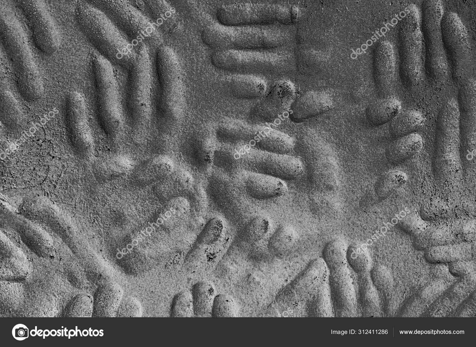 Fingerprints frozen on a gray clay surface, close-up, background ...