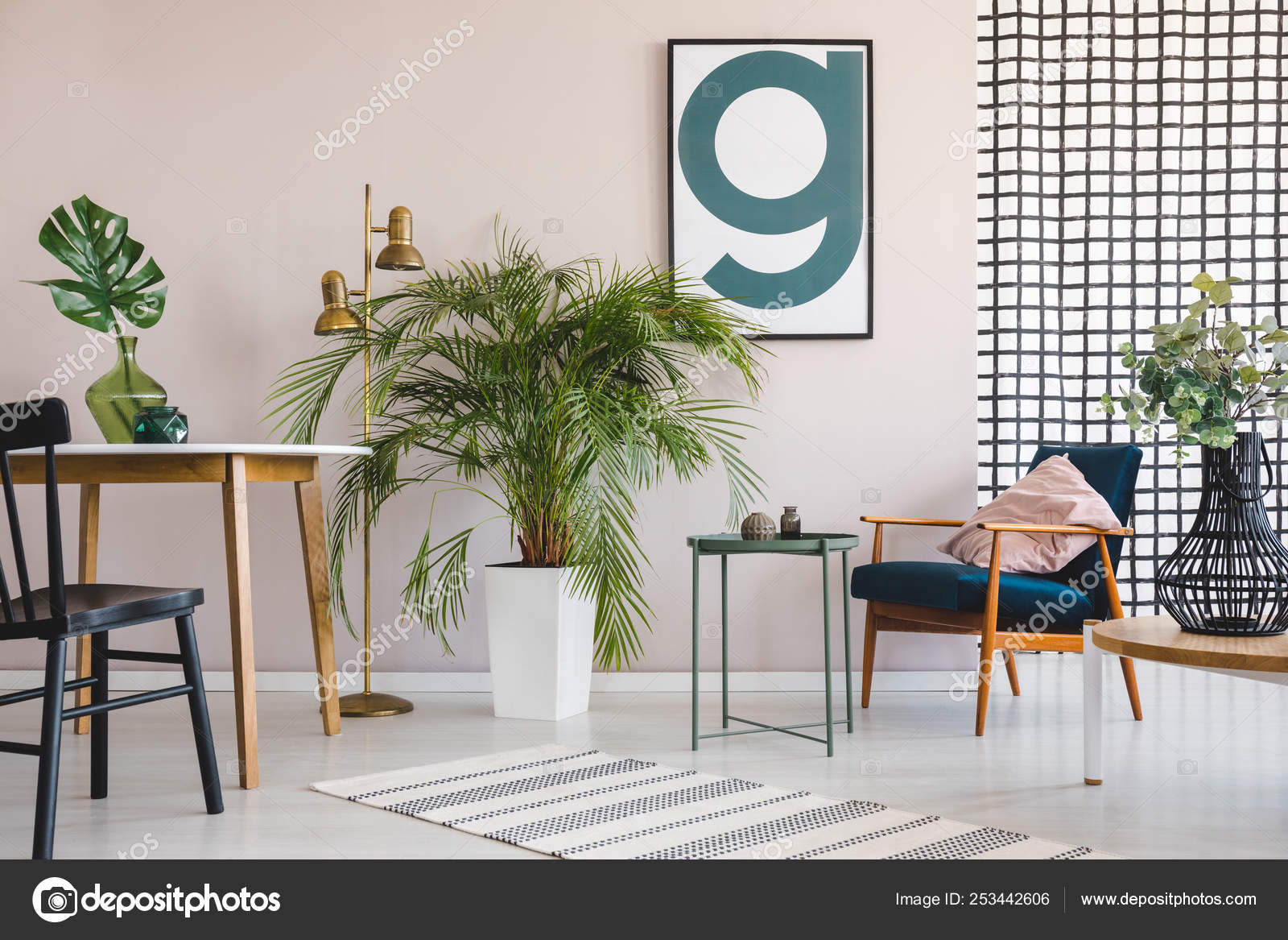 Chair at table with leaf in apartment interior with plants, wooden ...
