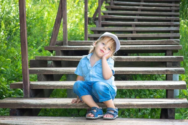 Boy sitting steps Stock Photos, Royalty Free Boy sitting steps Images ...